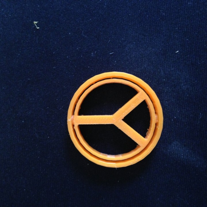 3D Printable Spinning Peace Sign Symbol by Brendon Leonard