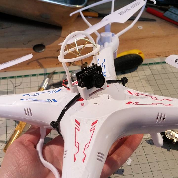 3D Printable The Whoopinator- FPV Quad Camera Mount by Naomi Wu