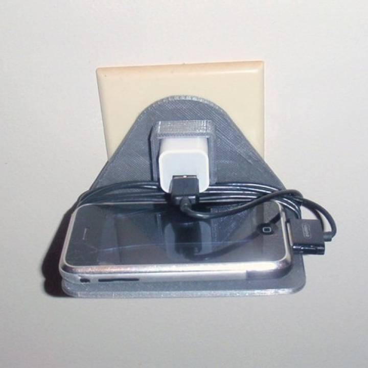 3D Printable WALL OUTLET CELLPHONE HOLDER (IPHONE & IPOD) by Mark Fuller