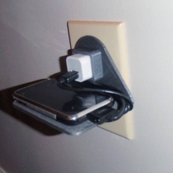 3D Printable WALL OUTLET CELLPHONE HOLDER (IPHONE & IPOD) by Mark Fuller