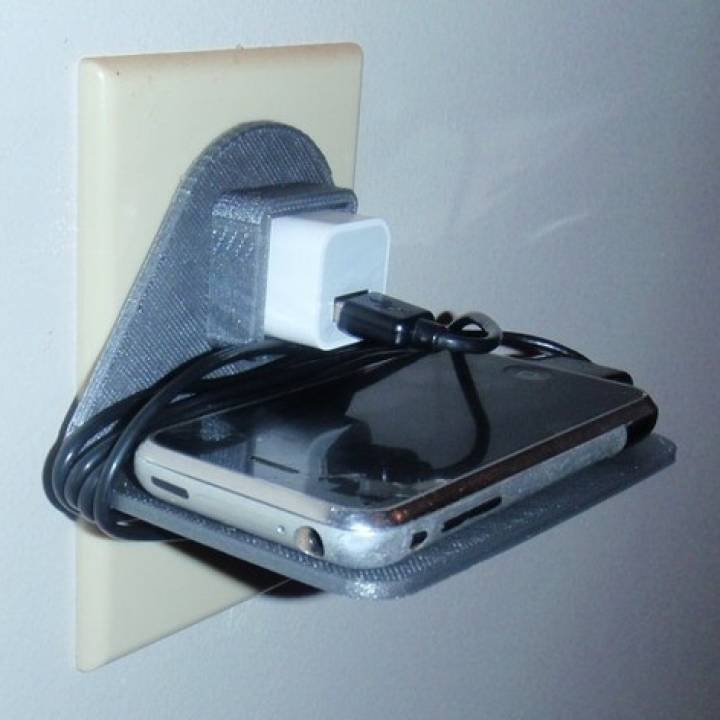 3D Printable WALL OUTLET CELLPHONE HOLDER (IPHONE & IPOD) by Mark Fuller