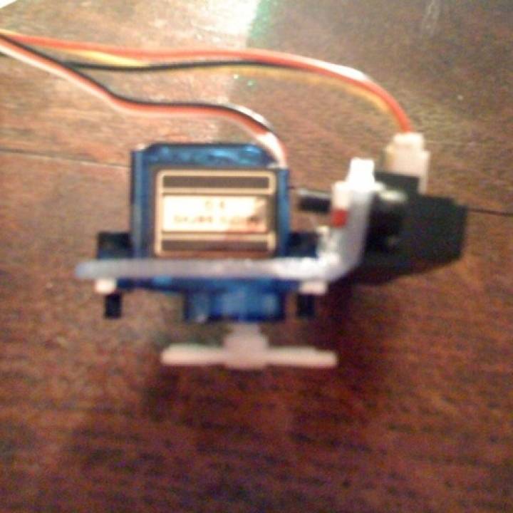 3D Printable Sharp IR Sensor Servo Bracket by Mark Fuller