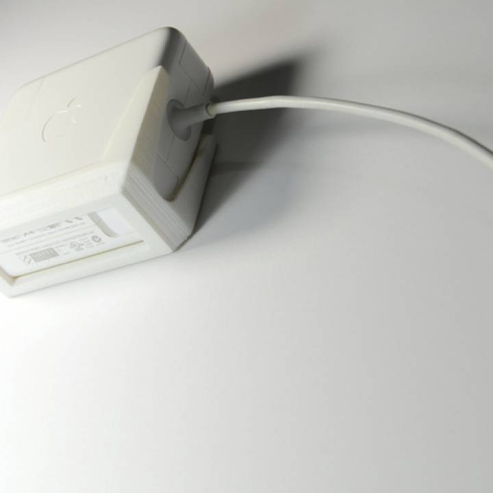 3D Printable Mac Power Adapter Holder by Henry Qiu