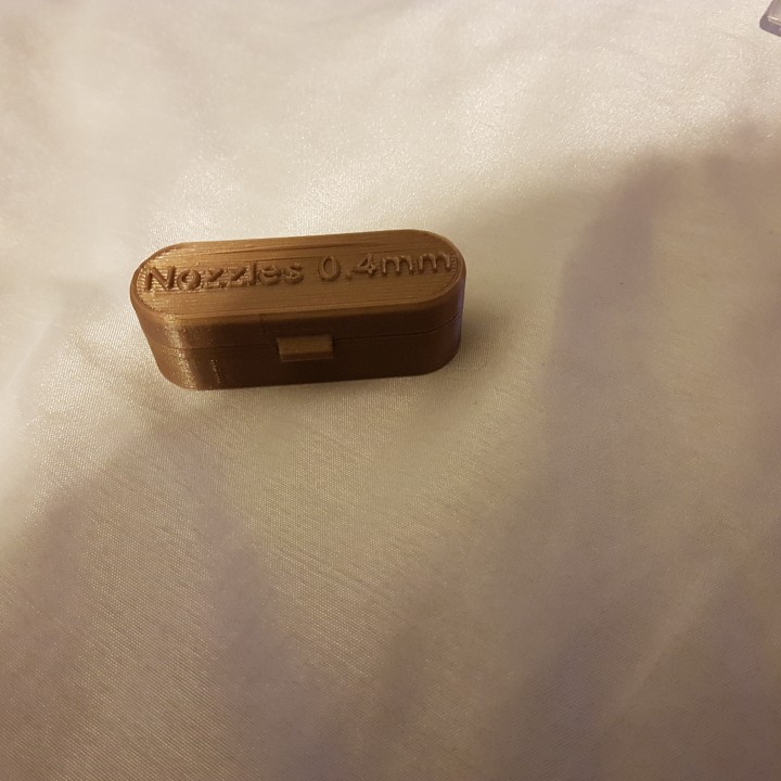 3D Printable Hinged Spare Nozzle Case by Martin