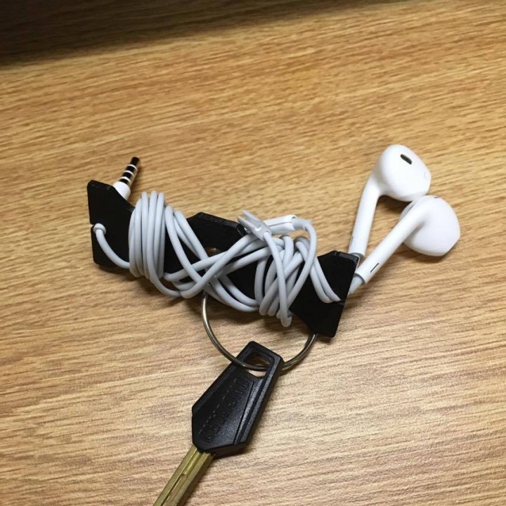 3D Printable Keychain Earbuds Holder by Rhys Switzer