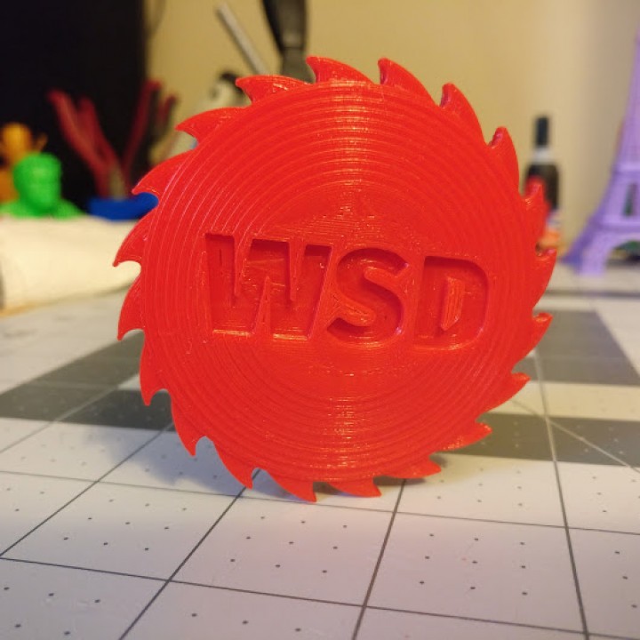 3D Printable WoodShedDesigns Saw Blade Maker Coin by Mark Sherwin