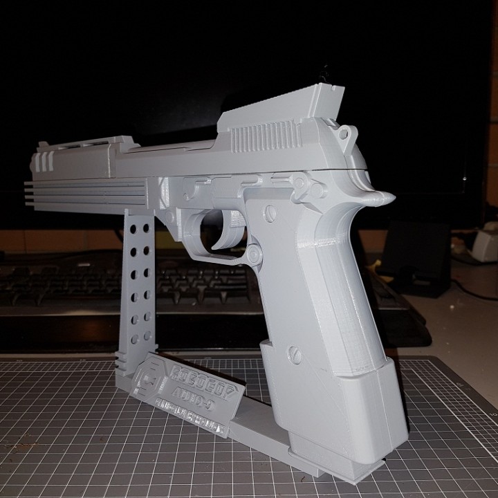 3D Printable Robocop Auto 9 Stand by Dale McIntyre