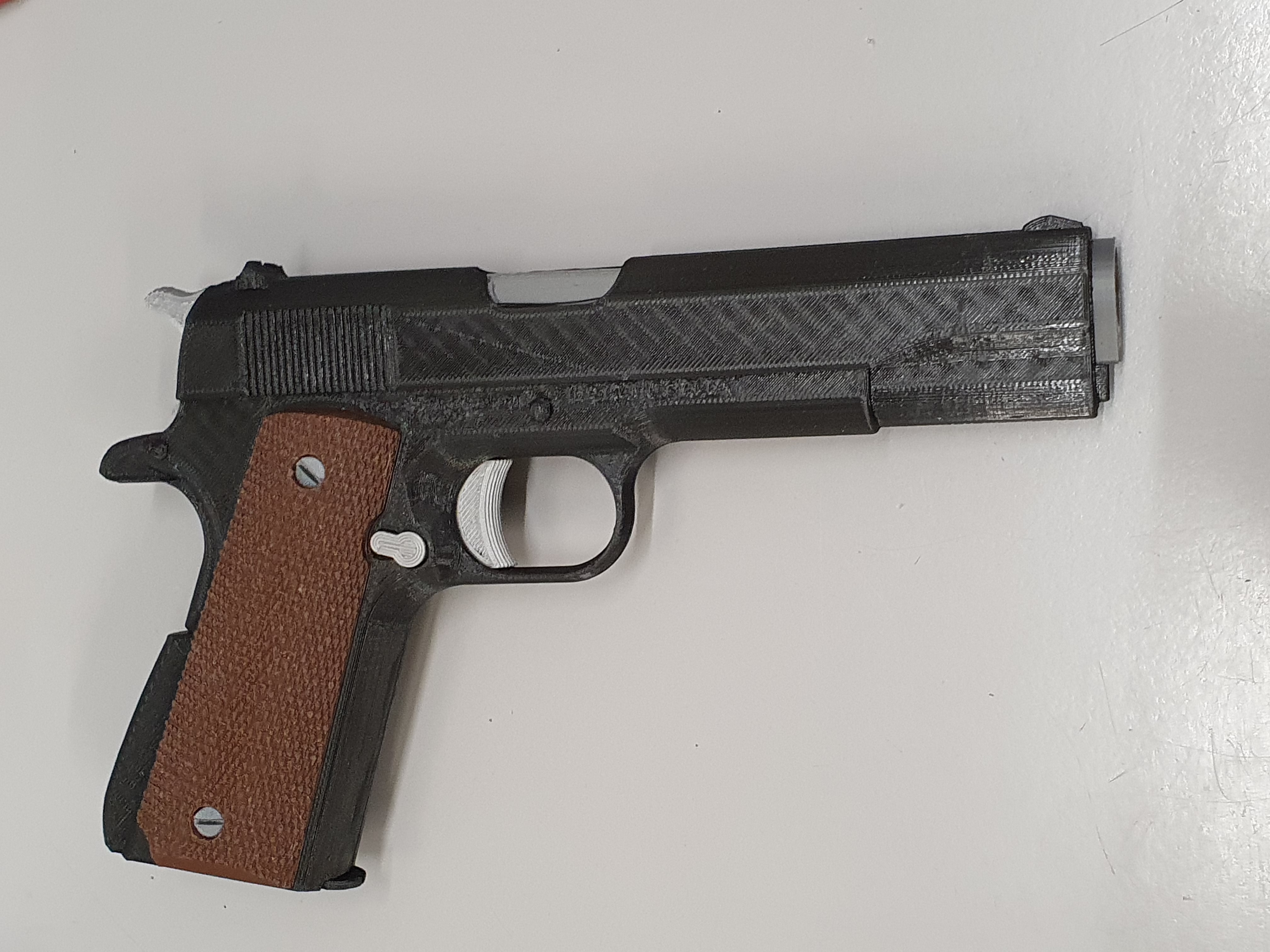 3D Printable Prop gun- Colt 1911 - Multicolor by Joe Prints