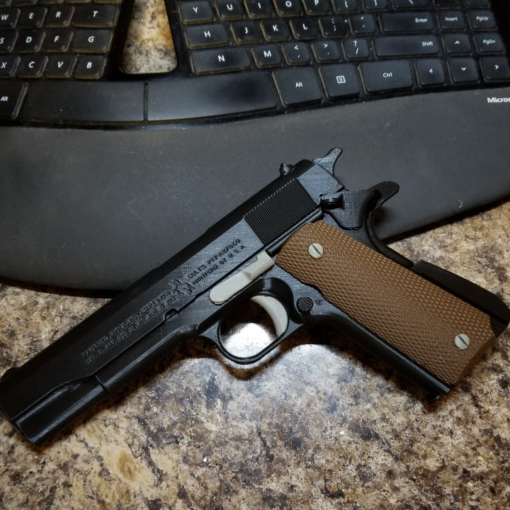 3D Printable Prop gun- Colt 1911 - Multicolor by Joe Prints