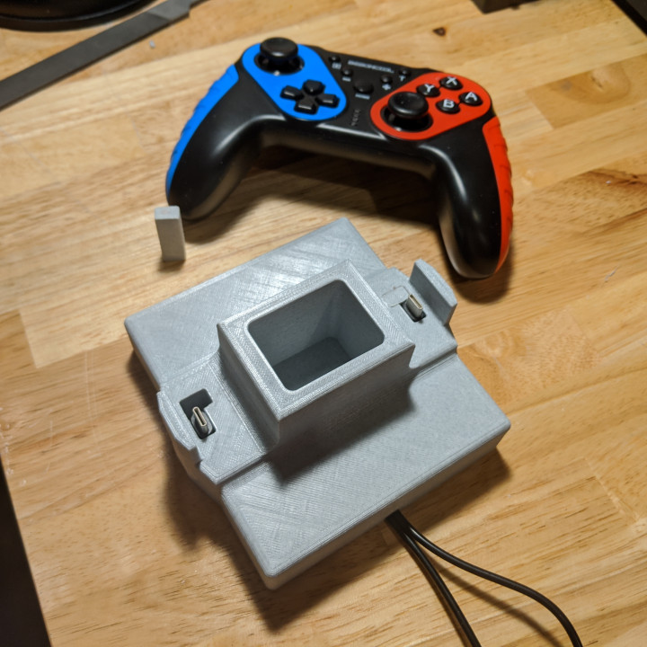 3D Printable Nintendo Switch Controller Charging Stand by Johnnie O.