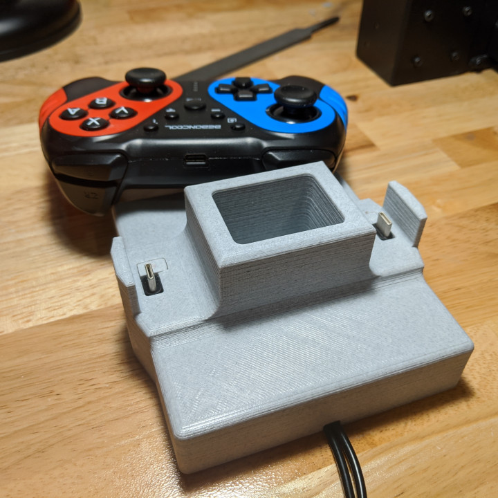 3D Printable Nintendo Switch Controller Charging Stand by Johnnie O.