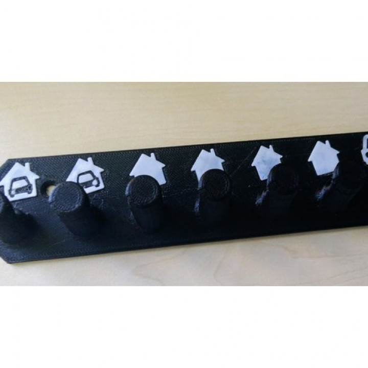 3D Printable 3D Printed Key Hanger with Icons by Václav Bílý