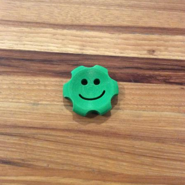 3D Printable Smiley Face Maker Coin by axeflayer